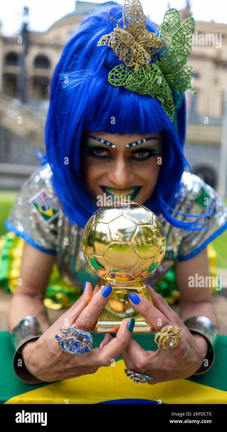 Dragqueen in her green and yellow outfit and makeup cheering during the ...