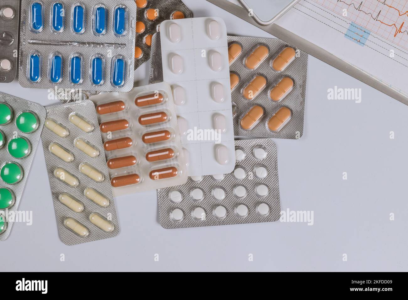 Many different pills on table with doctor medical office Stock Photo ...