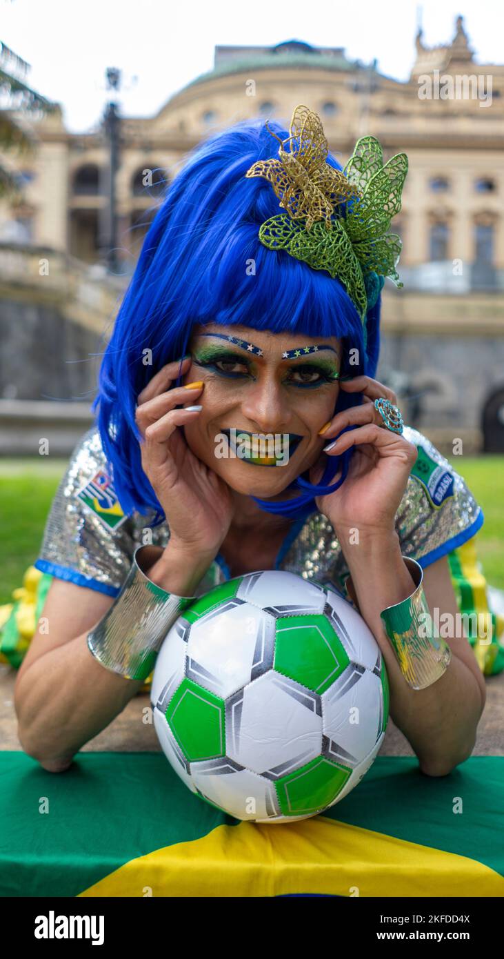 Dragqueen in her green and yellow outfit and makeup cheering during the ...