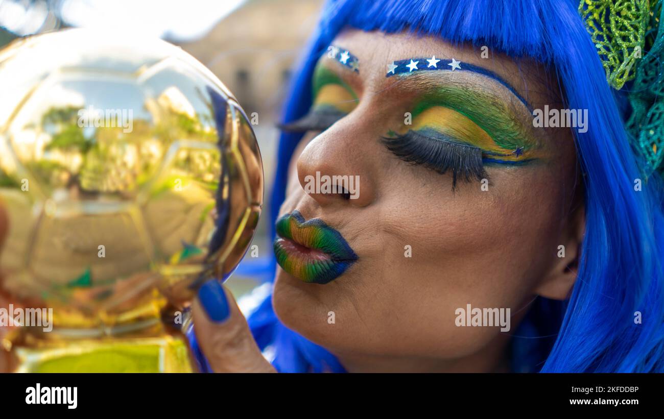 Dragqueen in her green and yellow outfit and makeup cheering during the ...