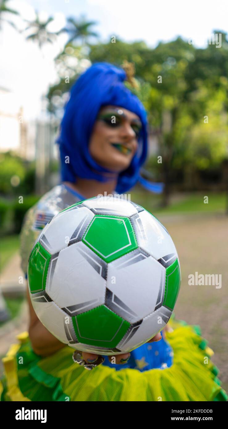 Dragqueen in her green and yellow outfit and makeup cheering during the ...