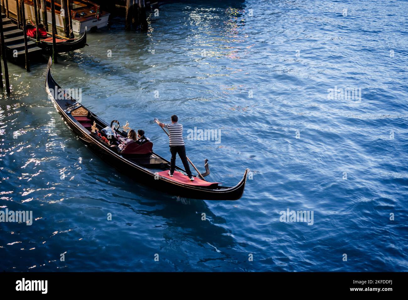 Traditional Venetian row boats gondolas on Grand Canal in Venice, Italy ...