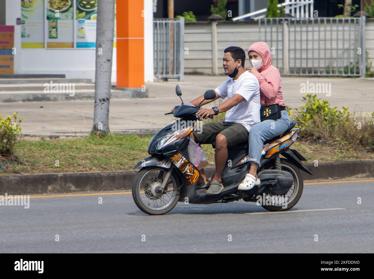Asian couple ride motorcycle hi-res stock photography and images - Alamy