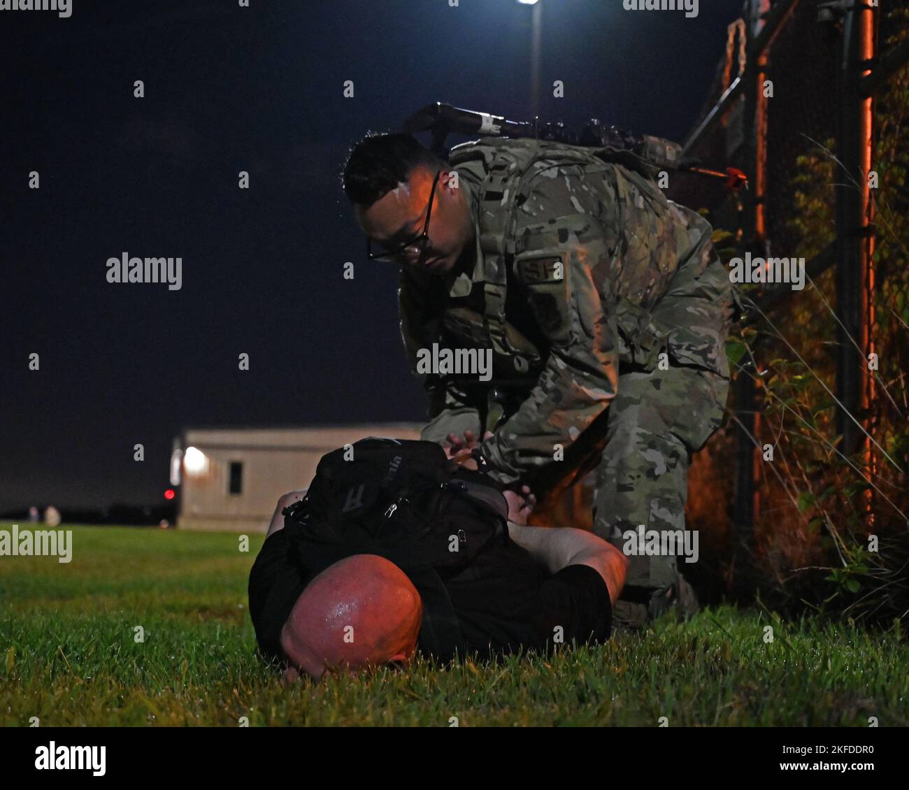 A member of the 175th Security Forces Squadron apprehends a red-team ...