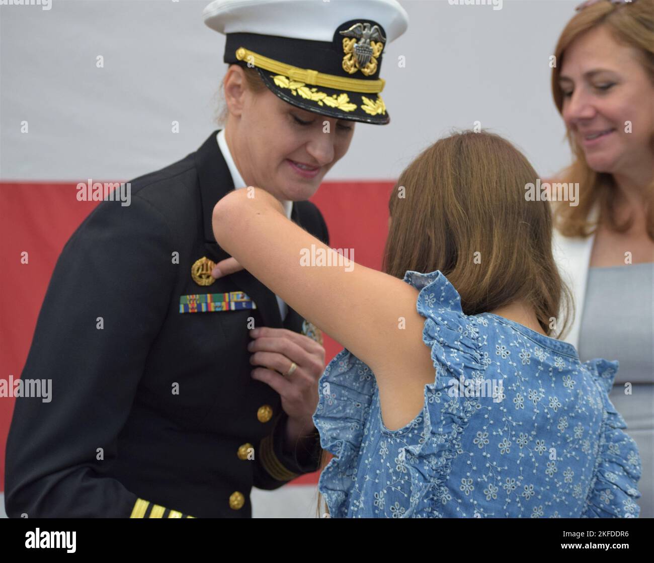 With a little family assistance... Capt. Juliann Althoff receives her ...