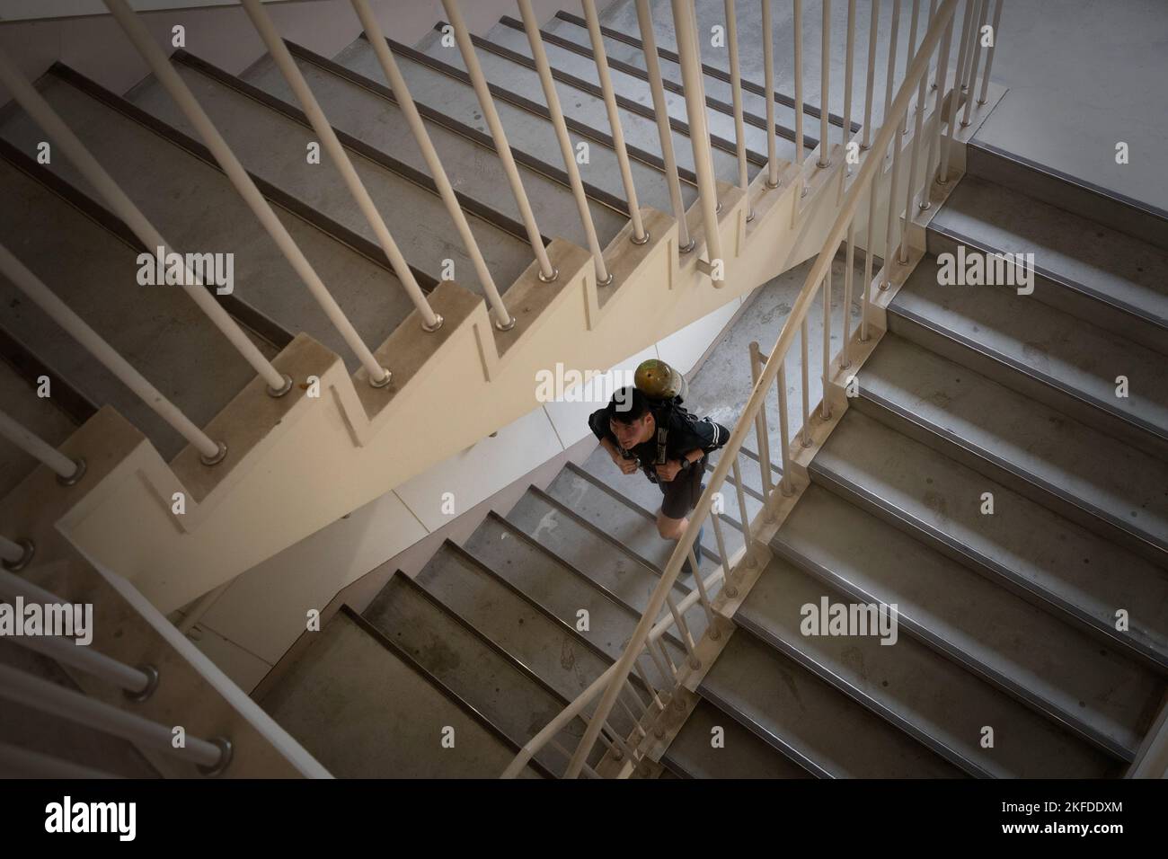 A tower run participant runs up a flight of stairs during the 9/11 ...