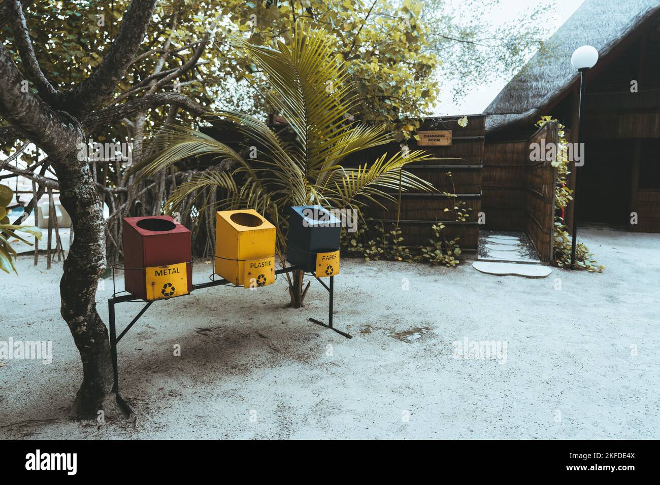 A wide-angle shot of three trash containers for separate waste ...