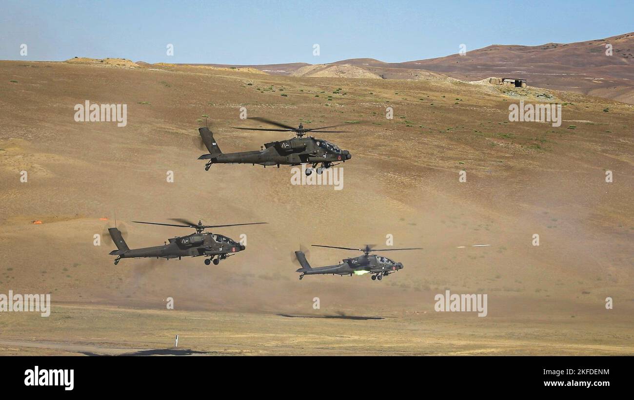 Three U.S. Army AH-64D Apache Longbow helicopters from the 12th Combat ...