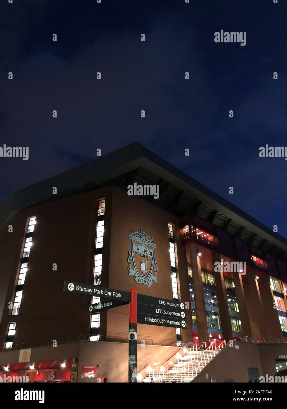 A vertical shot of the Anfield Stadium at night in Liverpool, UK Stock ...