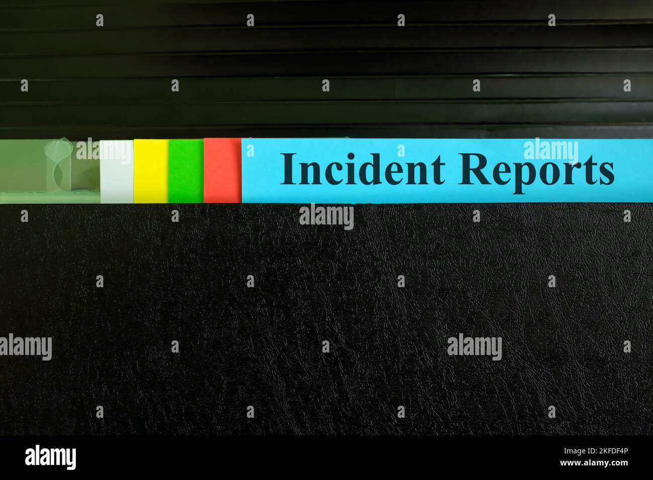Incident report file in black binder folder. Corporate business concept ...