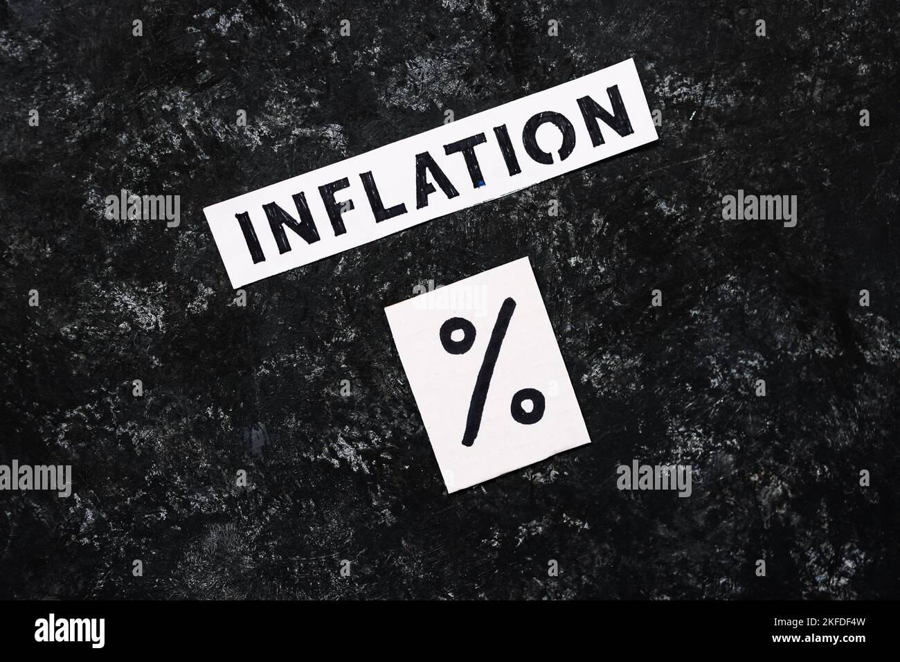 Inflation text with percentage symbol on dark background, concept of ...