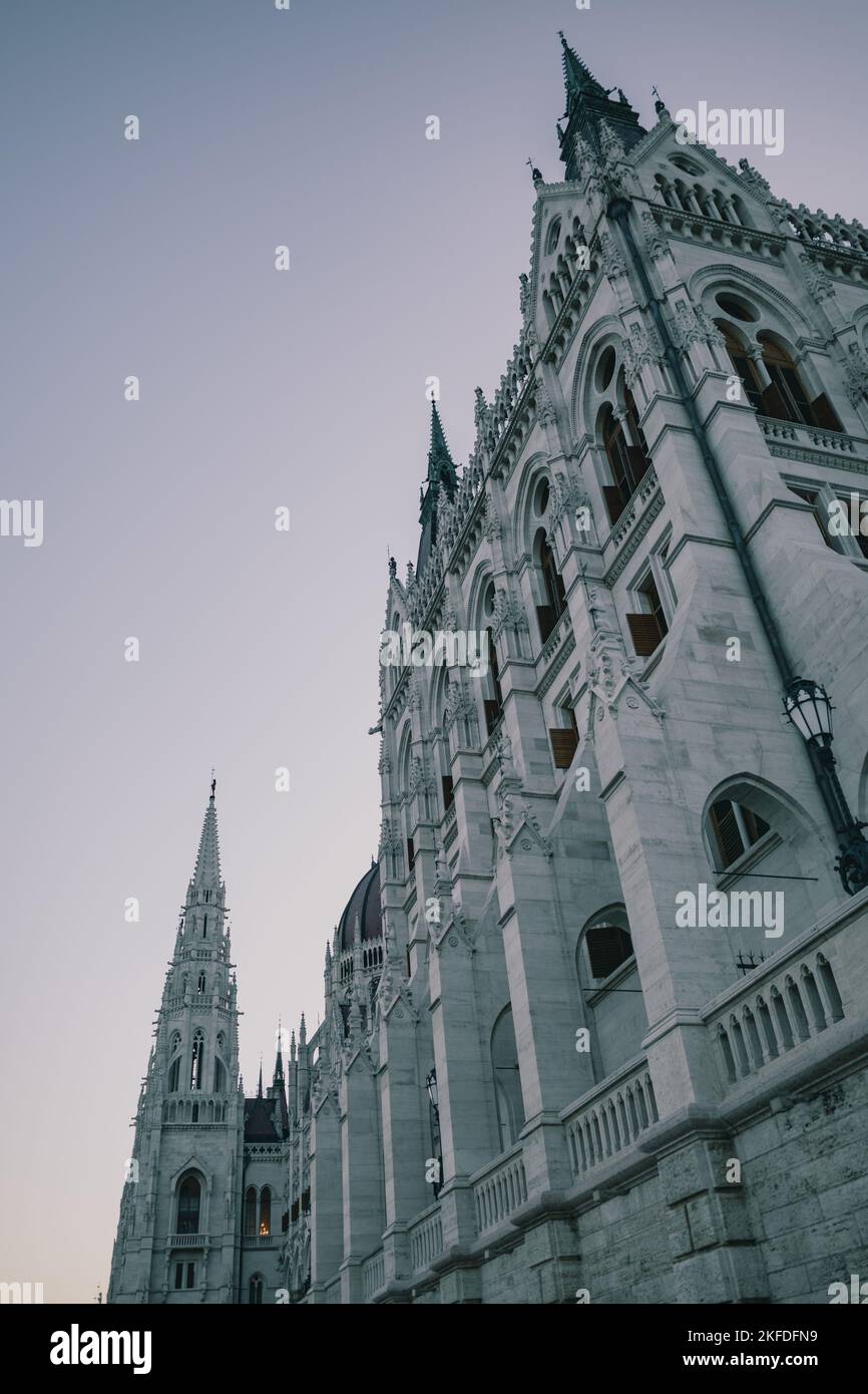 A vertical low angle grayscale shot of the Hungarian Parliament ...