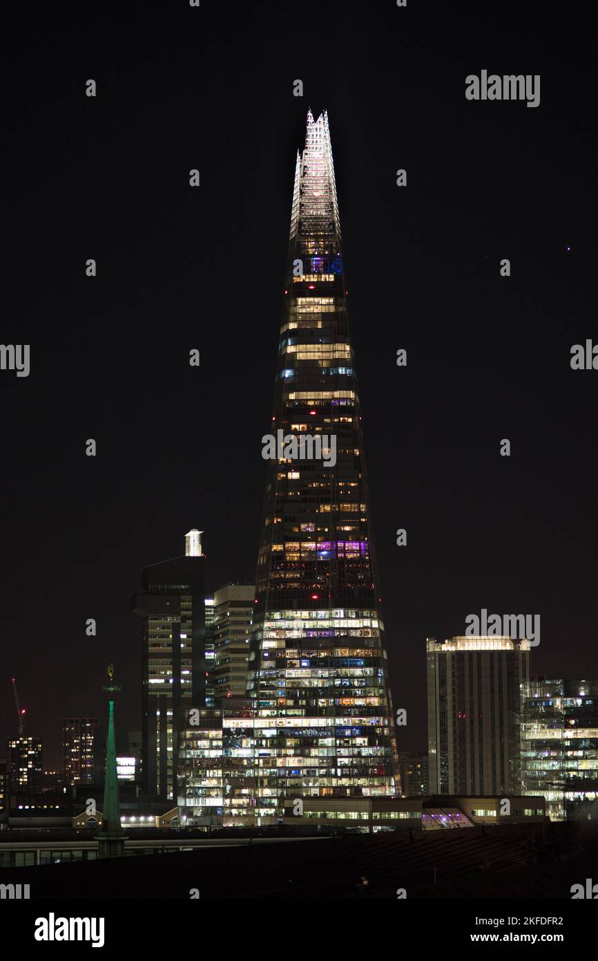 A vertical shot of the Shard building at night in London Stock Photo ...