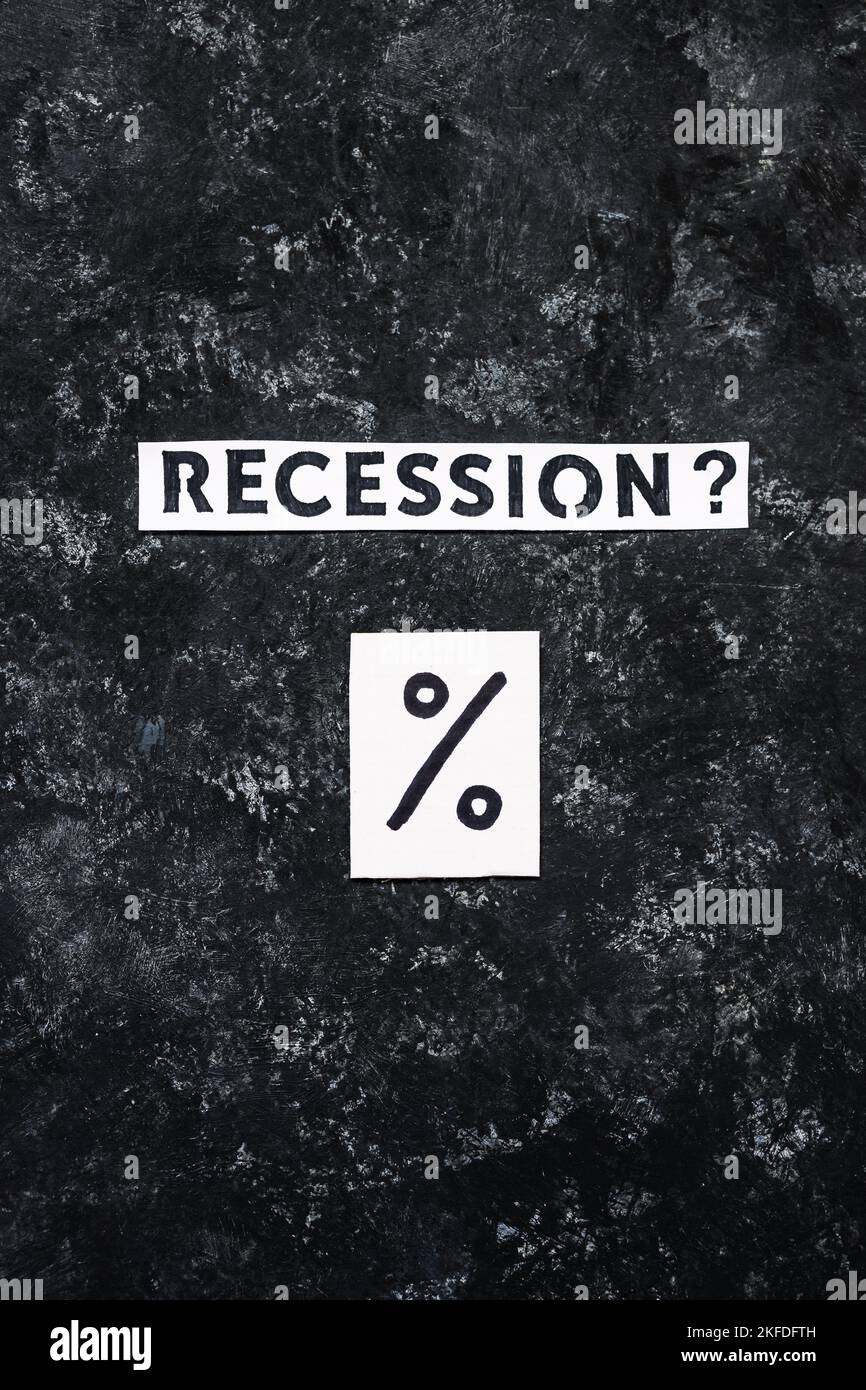 Recession text with question mark and percentage symbol on dark ...