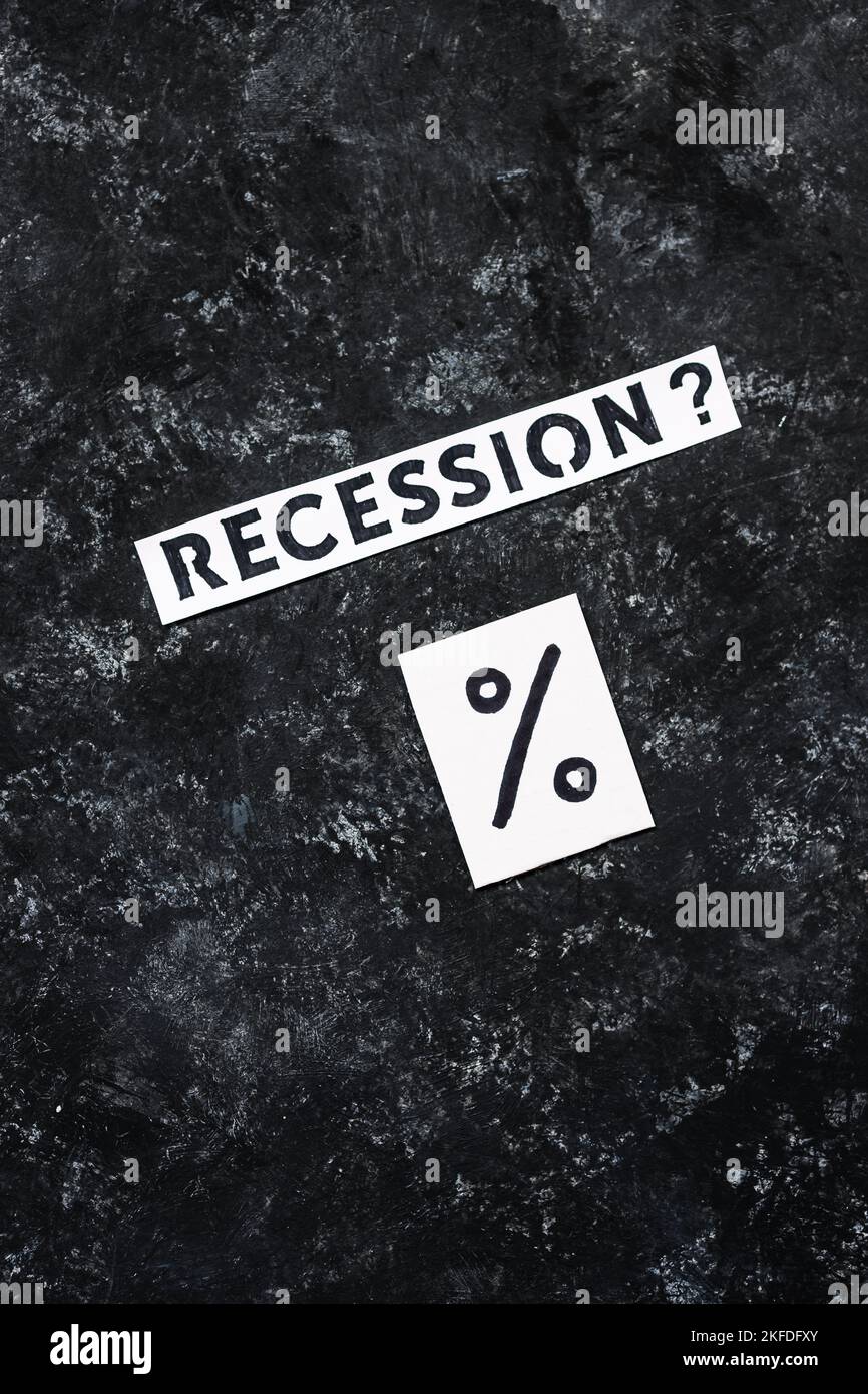 Recession text with question mark and percentage symbol on dark ...