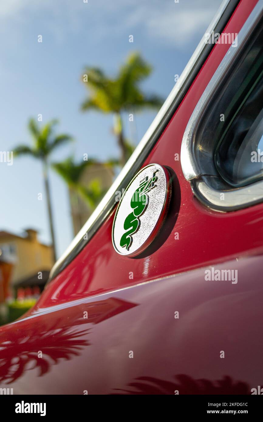 A red Alfa Romeo Classic Snake Logo badge in closeup Stock Photo - Alamy