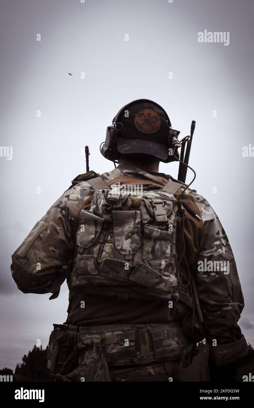 A U.S. Joint Terminal Attack Controller (JTAC) coordinates with a ...