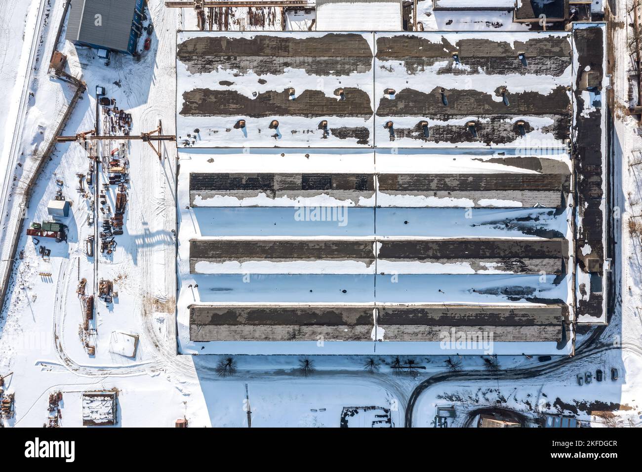 aerial top view of industrial area at winter time. factory building and ...