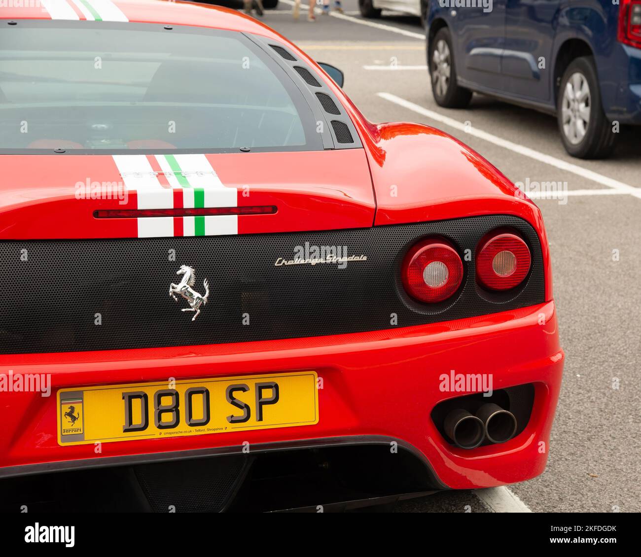 The luxury Italian red Ferrari in the parking place Stock Photo - Alamy