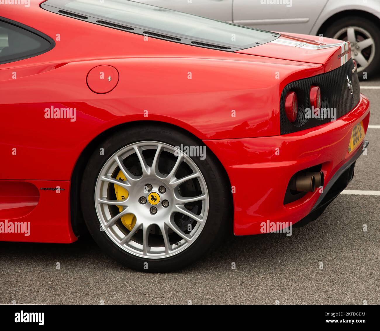 The luxury Italian red Ferrari in the parking place Stock Photo - Alamy