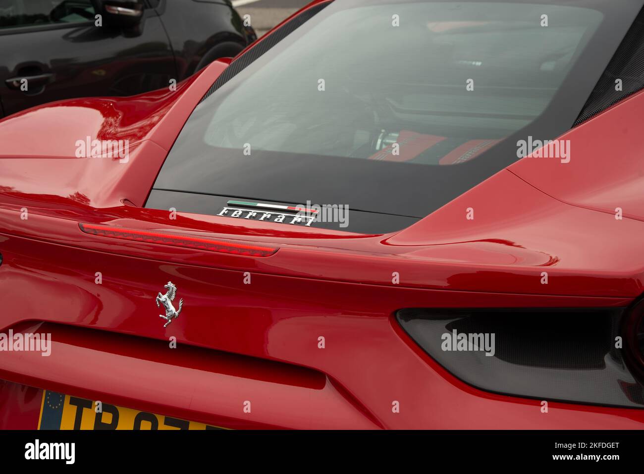 The luxury Italian red Ferrari in the parking place Stock Photo - Alamy