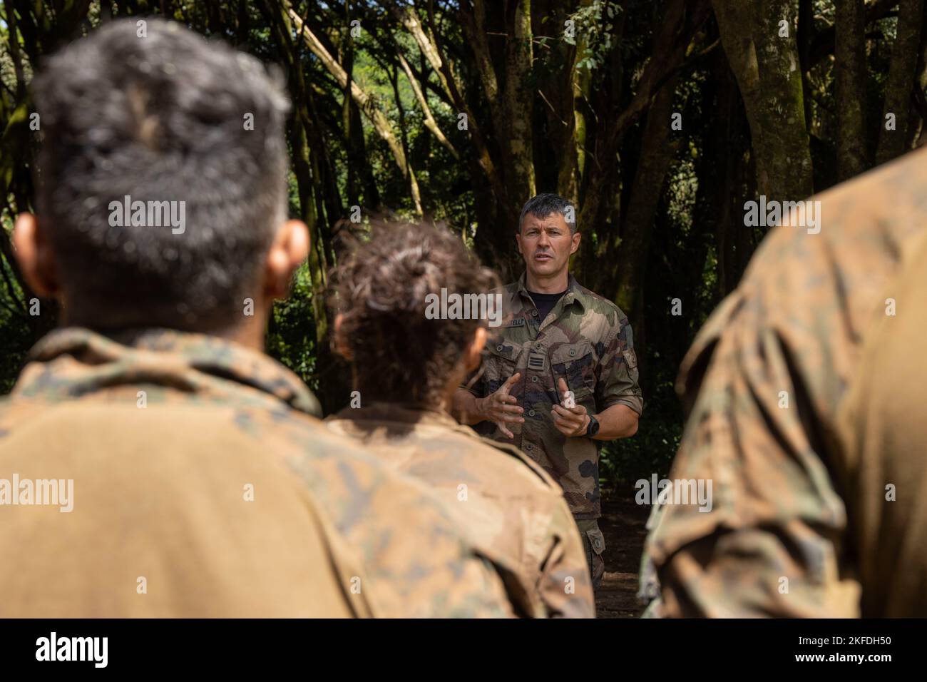French Army Capt. Phillippe Locatelli, center, senior Aito instructor ...