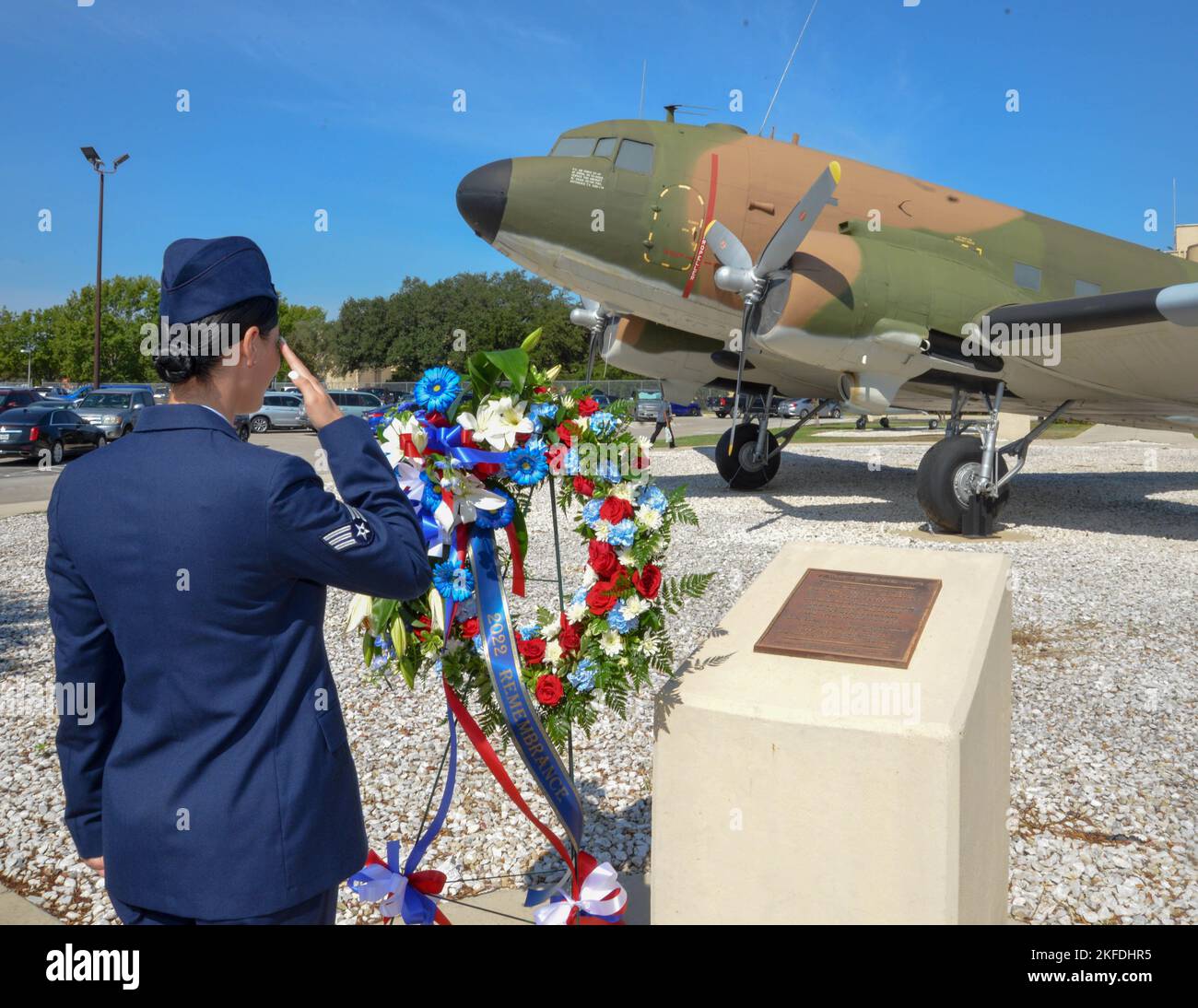 An airmen, salutes a wreath to honor the memory of silent warriors that ...