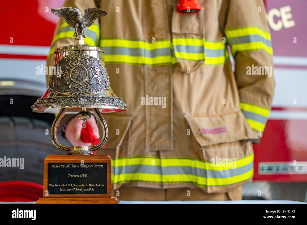 A 341st Civil Engineer Fire Department Airman rings the Malmstrom Air ...
