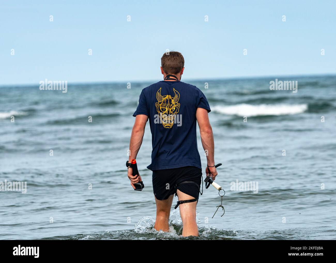 U.S. Navy ND3 Samuel Harrison, a Navy diver assigned to the Defense POW ...