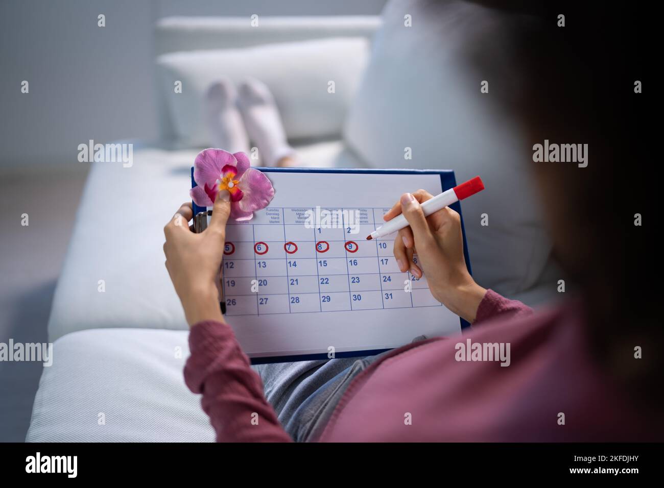 African Woman Using Menstrual Cycle Or Period Calendar Stock Photo - Alamy