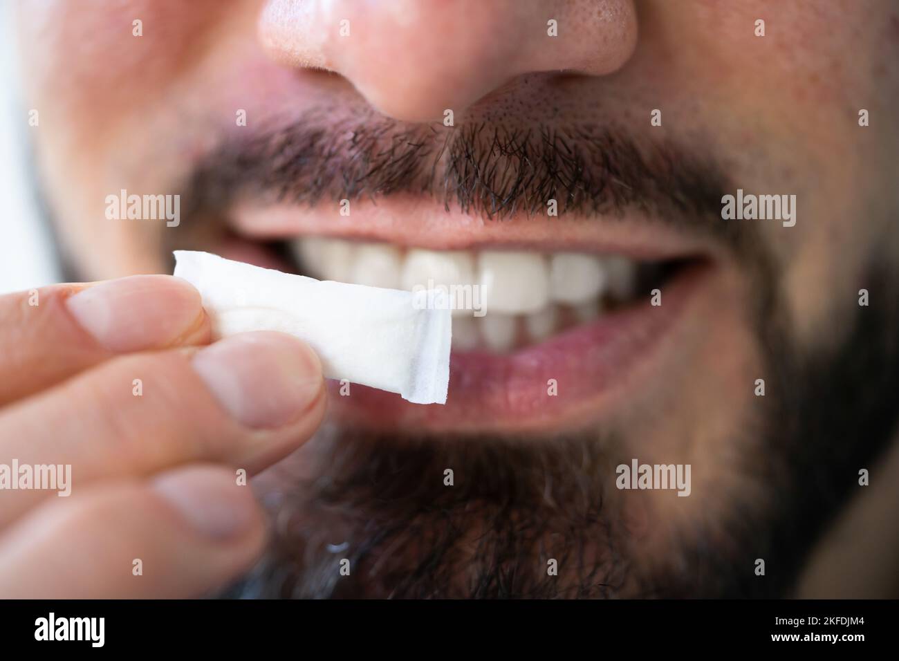 Man Chewing Wet Moist Nicotine Tobacco Snus Product Stock Photo - Alamy