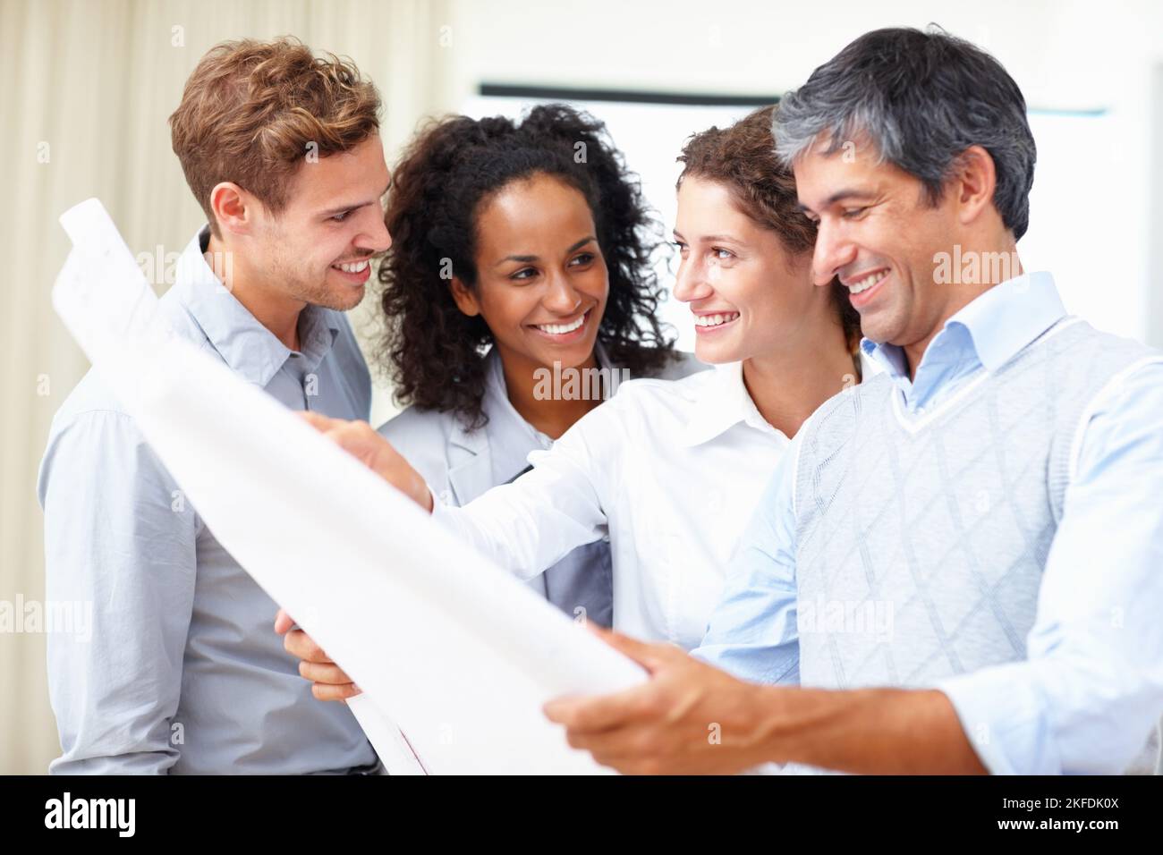 Team of engineers. Group of business people in discussion with ...