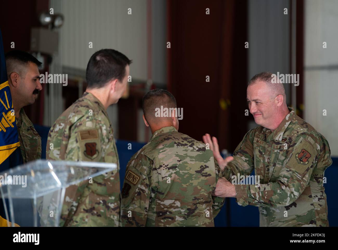 U.S. Air Force Chief Master Sgt. Michael E. Dixon, Jr. receives a patch ...