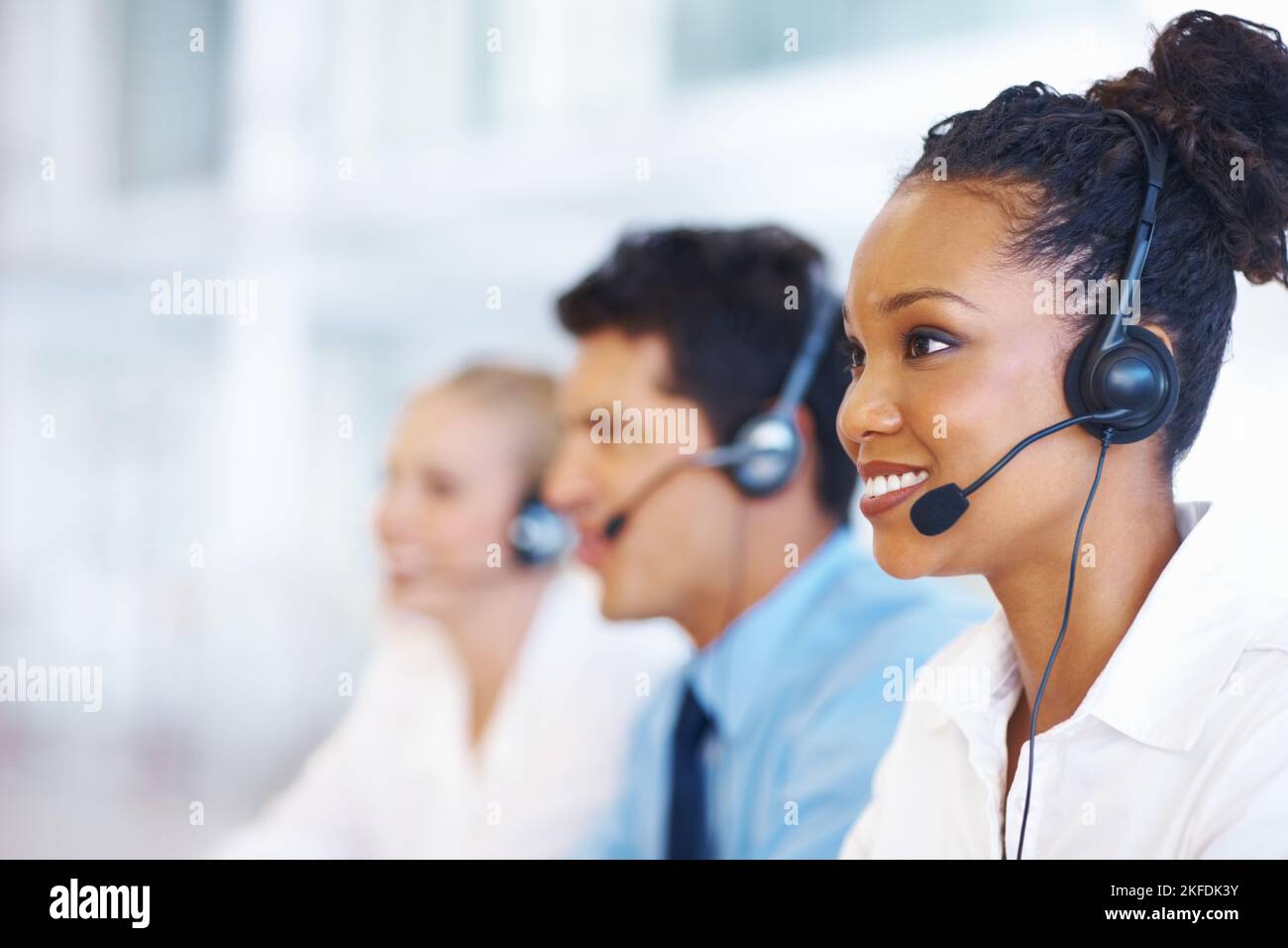 Female operator. Closeup of African American female representative on ...