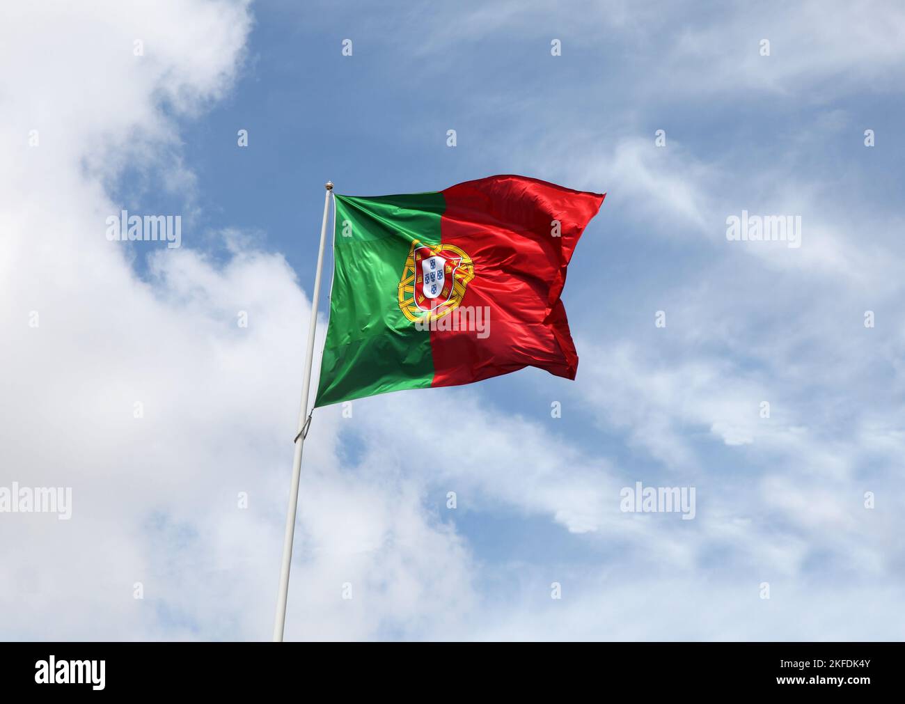 A Portuguese flag flying in the wind Stock Photo - Alamy