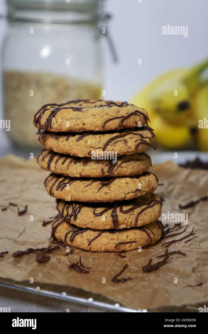 banana oatmeal cookies with chocolate chips, bananas in background ...