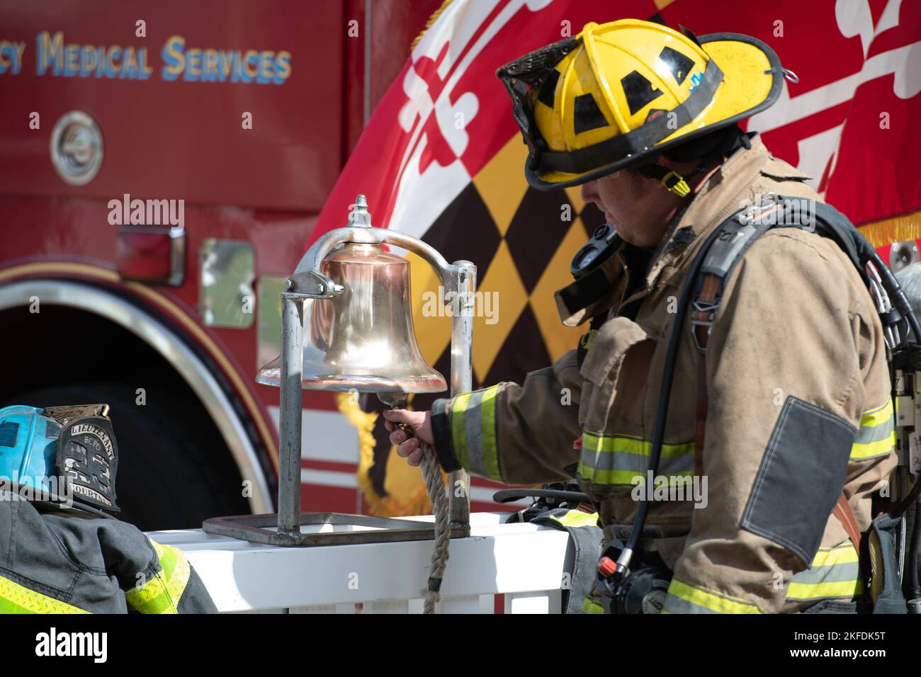 BALTIMORE (Sept. 10, 2022) - A local firefighter rings a bell after ...