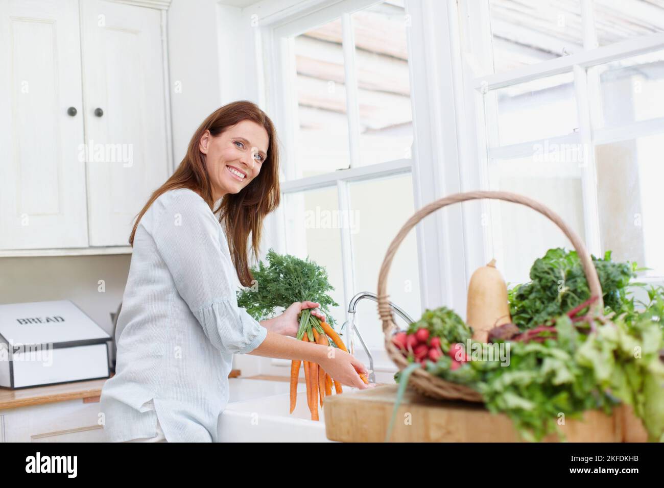 Always wash vegetables before eating them. Portrait of a beautiful ...