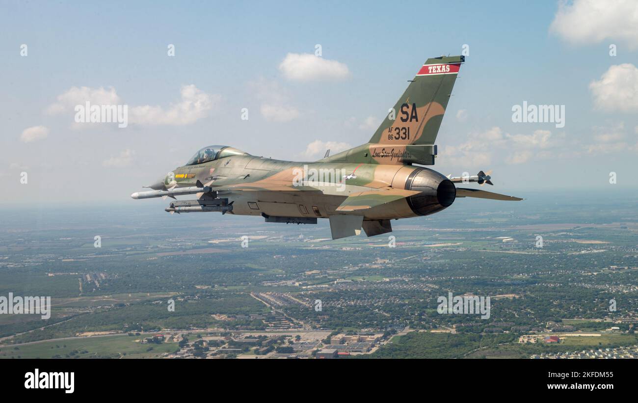 An F-16 Fighting Falcon, assigned to the 149th Fighter Wing, flies over ...