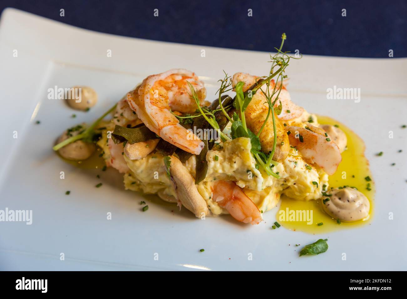 A closeup of a salad with shrimp served on a plate Stock Photo - Alamy