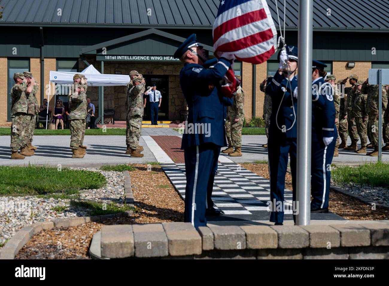 Members of the 181st Intelligence Wing salute a retreat ceremony at ...