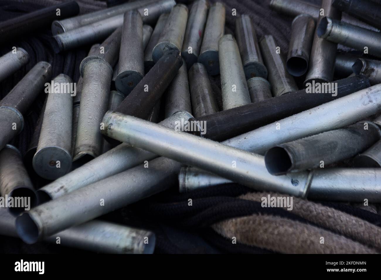 Shell casings lay on the deck after a MK-75 gunnery exercise on the ...