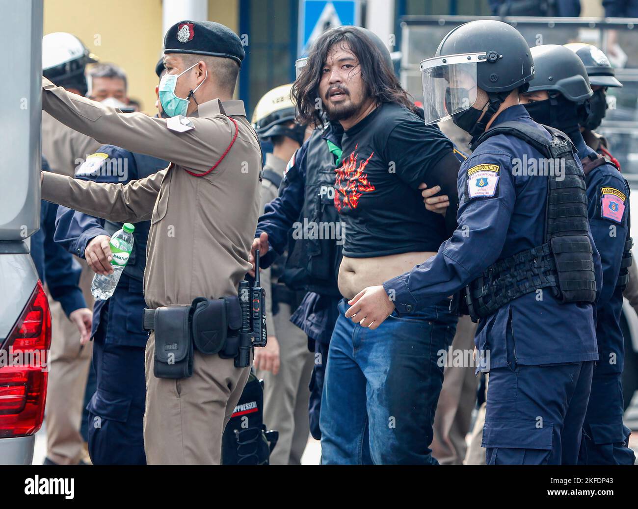 Bangkok, Thailand. 18th Nov, 2022. Police officers arrest a demonstrator against the Asia ...