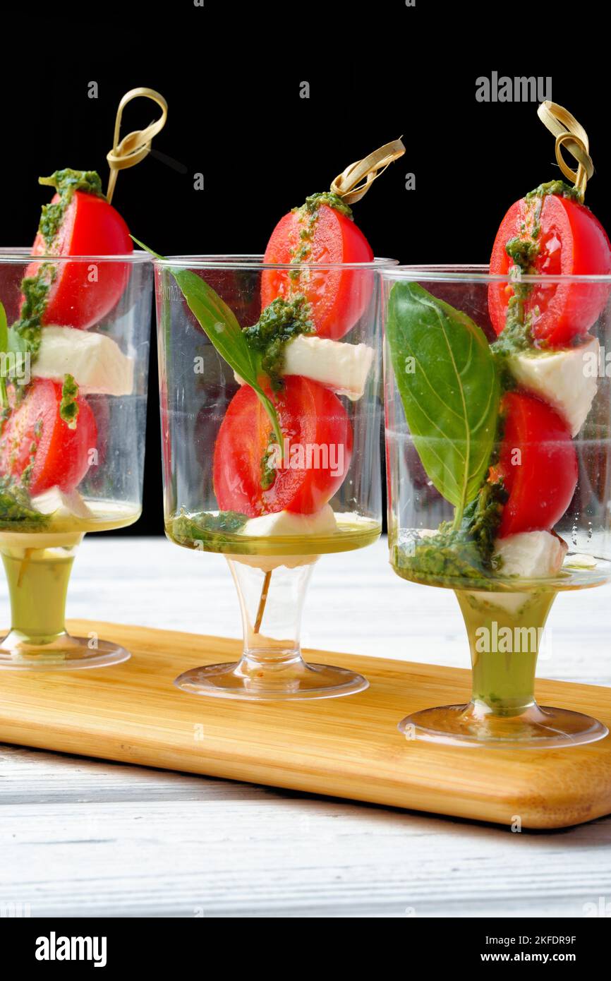 Caprese canapes in glasses on a skewer Stock Photo - Alamy