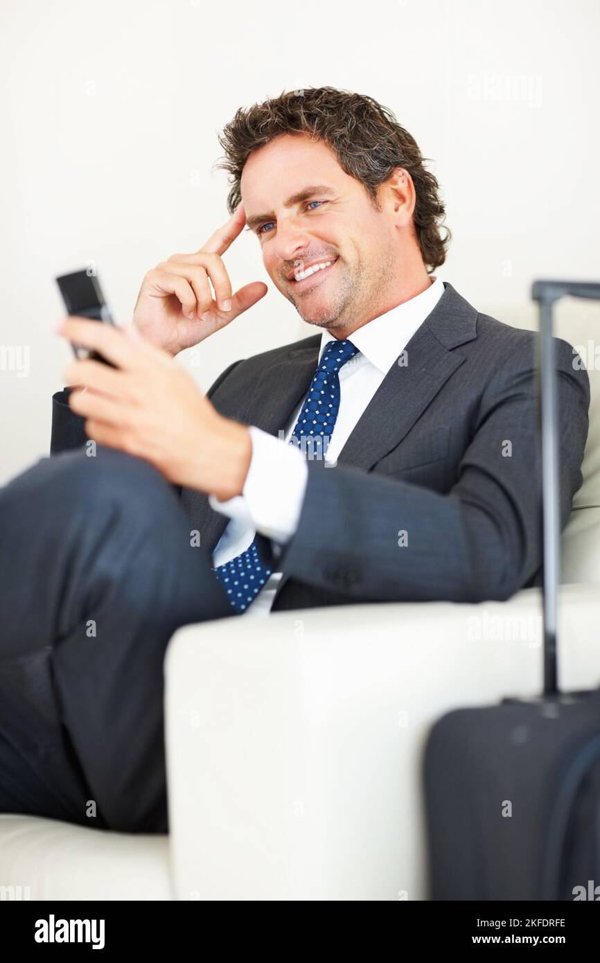 Business man ready for business tour. Handsome business man sitting on ...