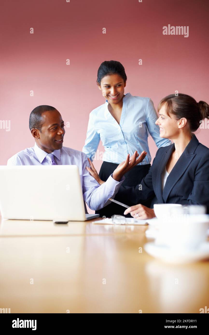 Thats a great idea. Executive commenting on colleagues idea Stock Photo ...