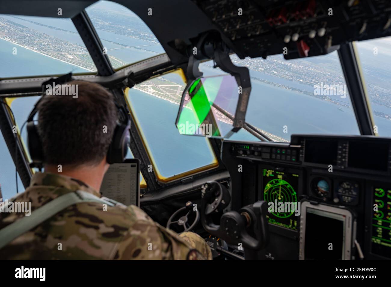 Maj. Dan Morgese, 39th Rescue Squadron pilot, scans the coast of ...