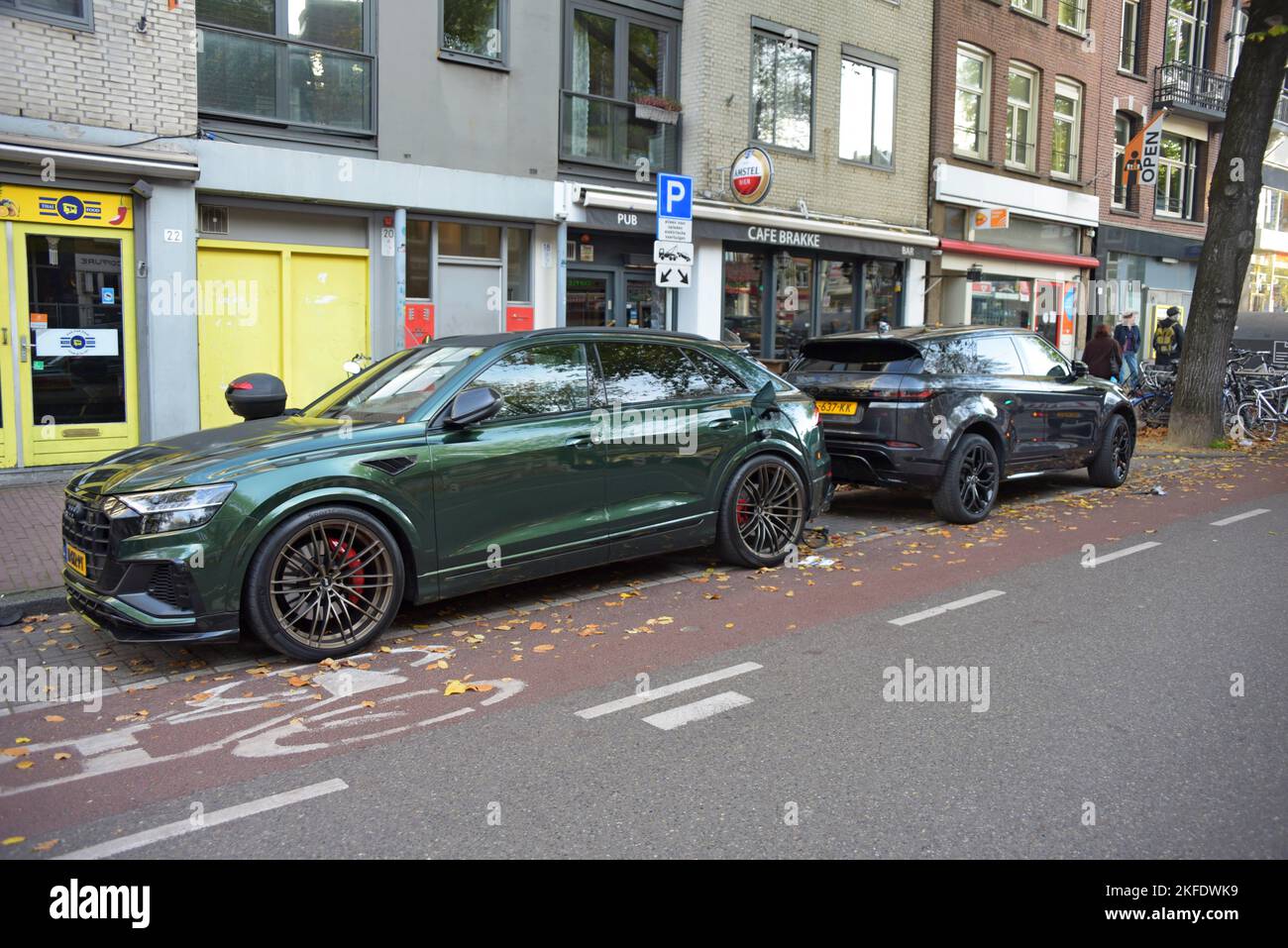 EV electric Range rover and Audi cars charging at an on street charging ...