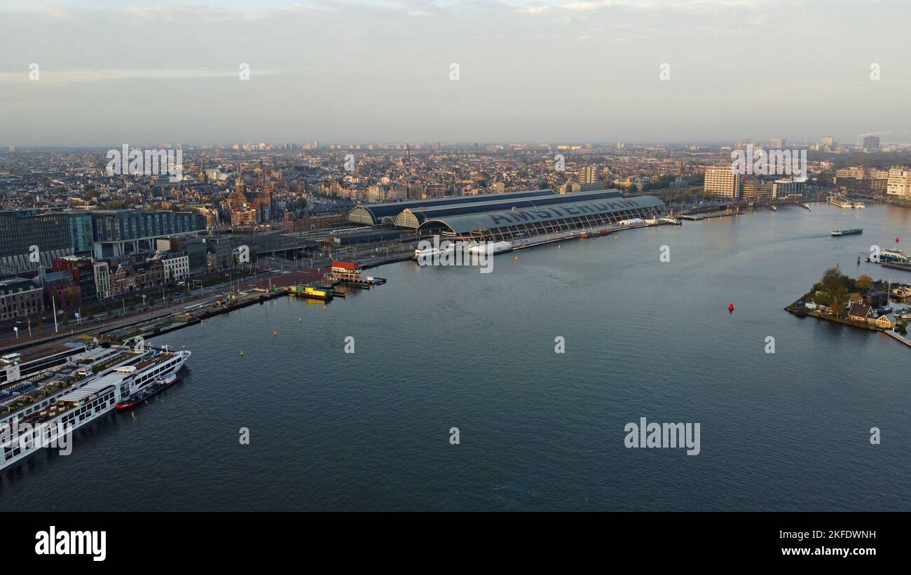 A drone photo aerial view of the Ij docklands and Amsterdam Centraal ...