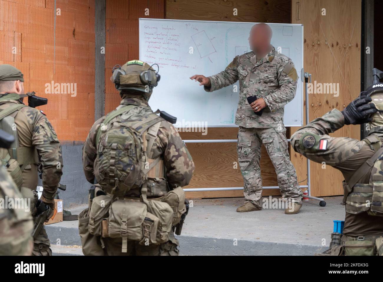 A Green Beret assigned to 10th Special Forces Group (Airborne) works ...